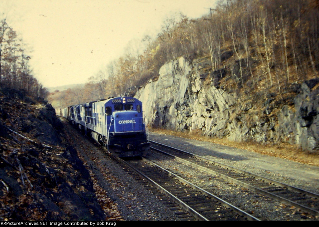 CR 6566 eases a mixed freight down the hill through the Middlefield gorge on the B&A